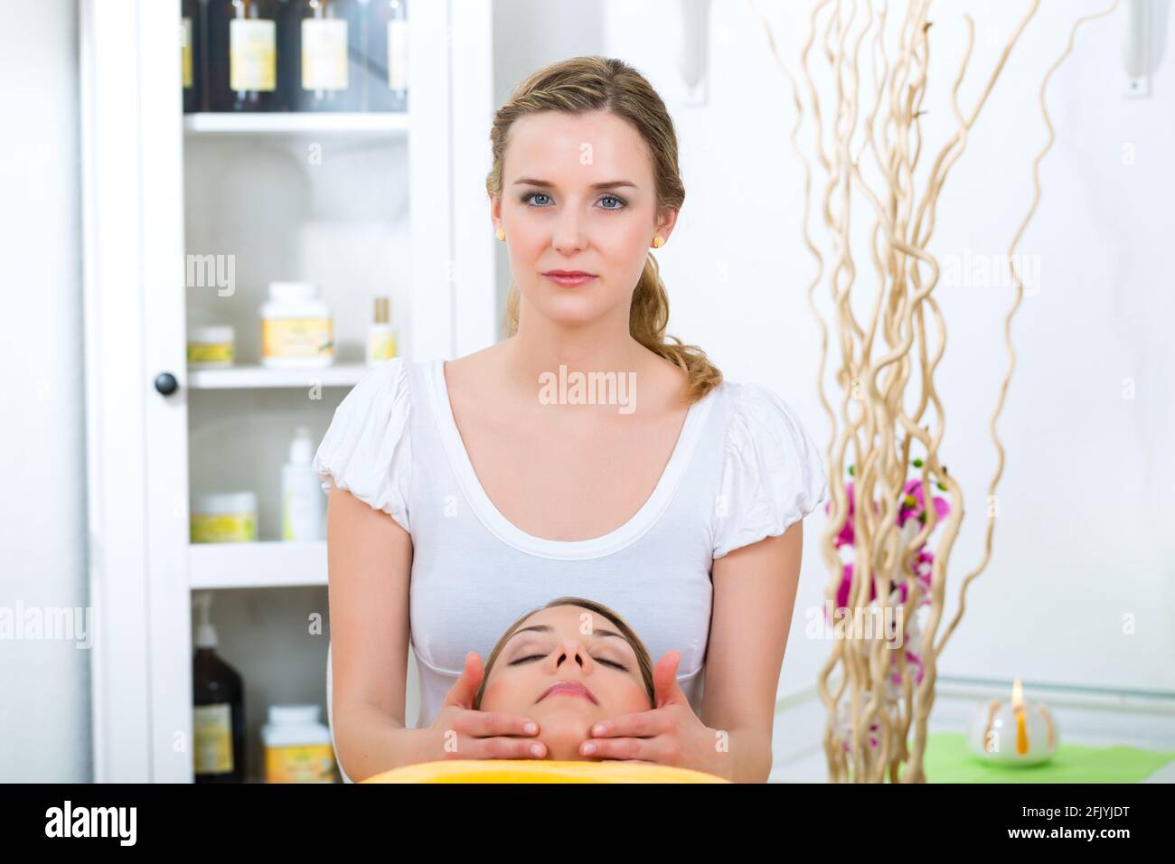 Wellness - woman receiving head or face massage in spa Stock Photo - Alamy