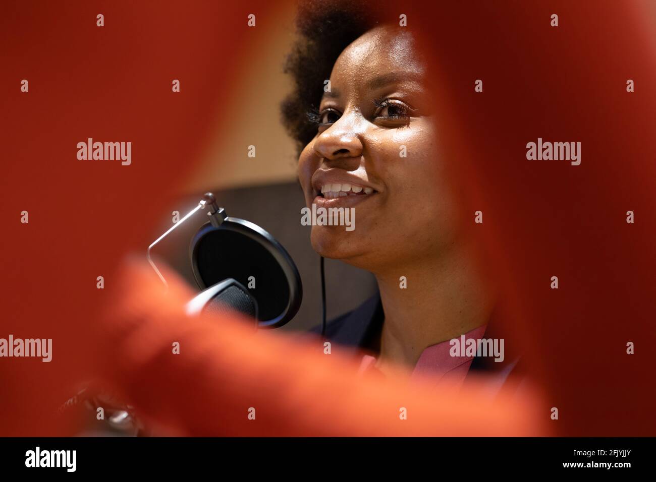 Smiling into microphone hi-res stock photography and images - Alamy