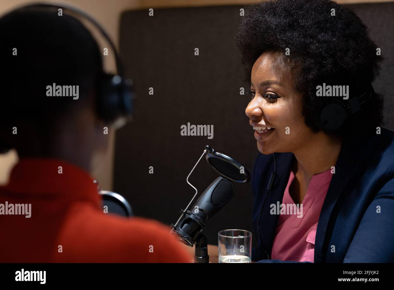 Young person speaking into microphone hi-res stock photography and ...