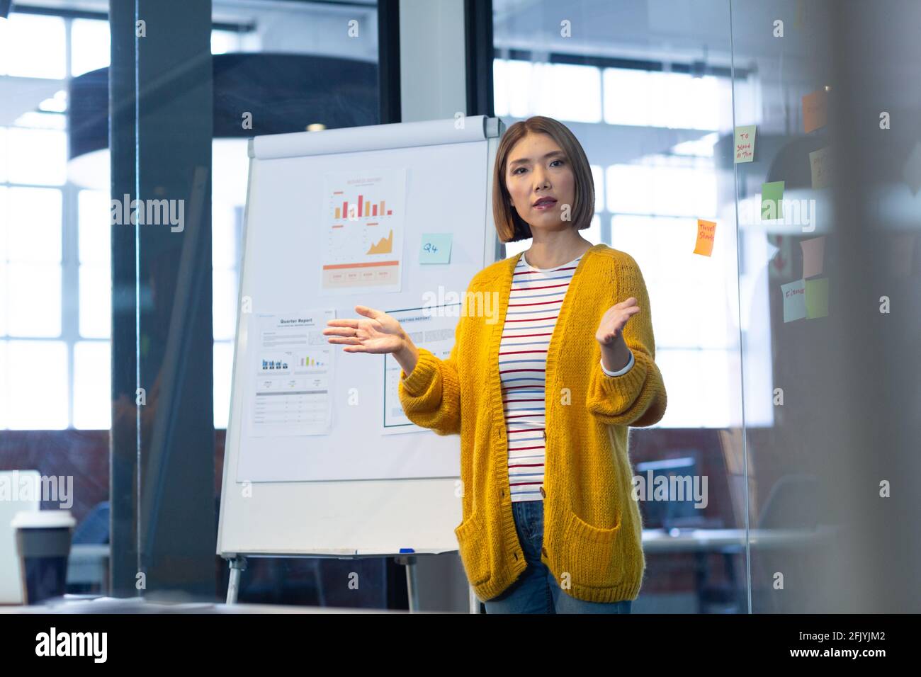 Asian person giving presentation hi-res stock photography and images ...