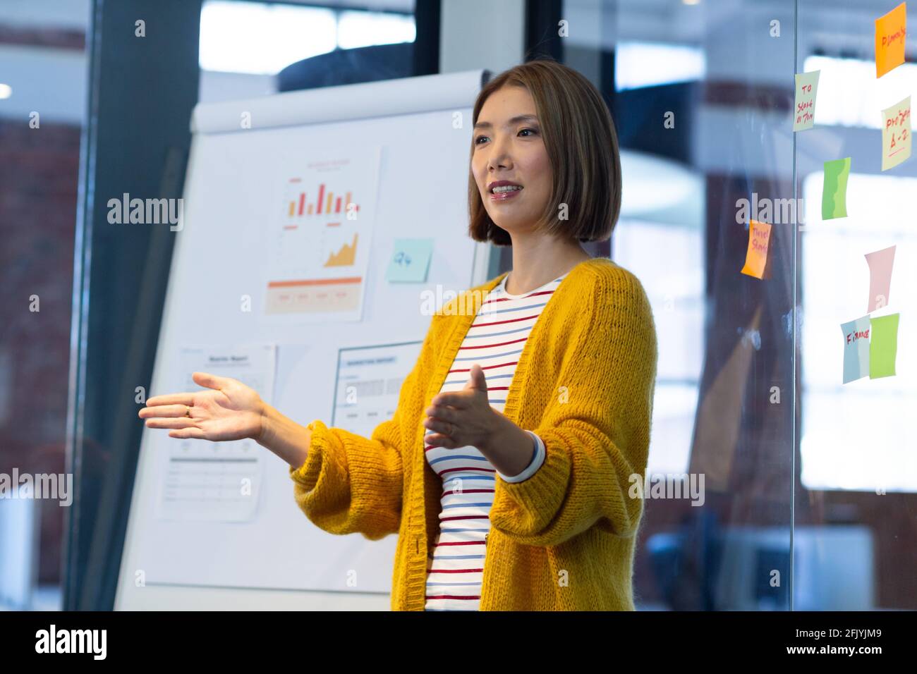 Asian person giving presentation hi-res stock photography and images ...
