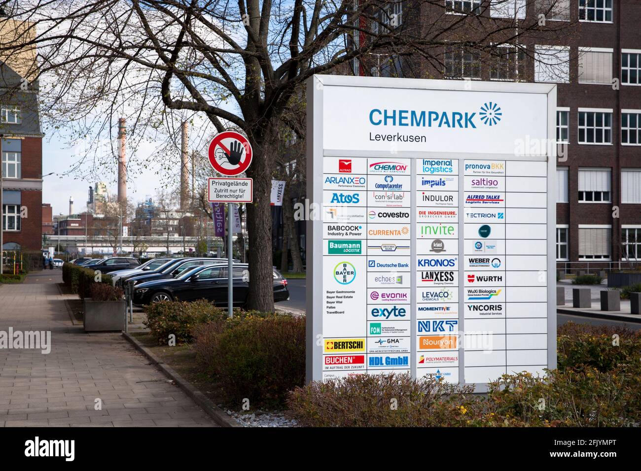company signs at an entrance road to the Chempark, Leverkusen, North ...