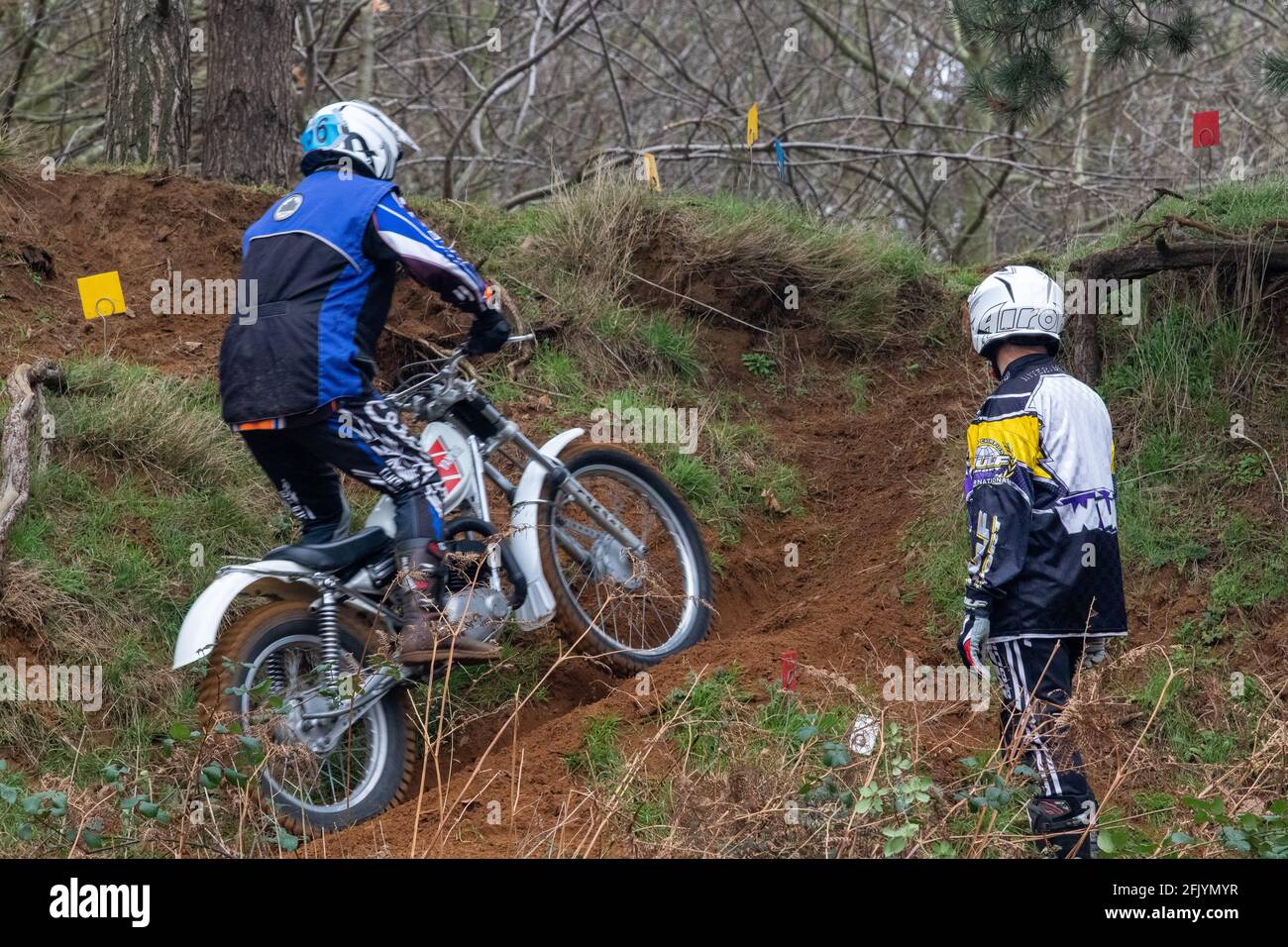 On the sandy soil of a coastal Suffolk motorcycle trial a rider surveys ...
