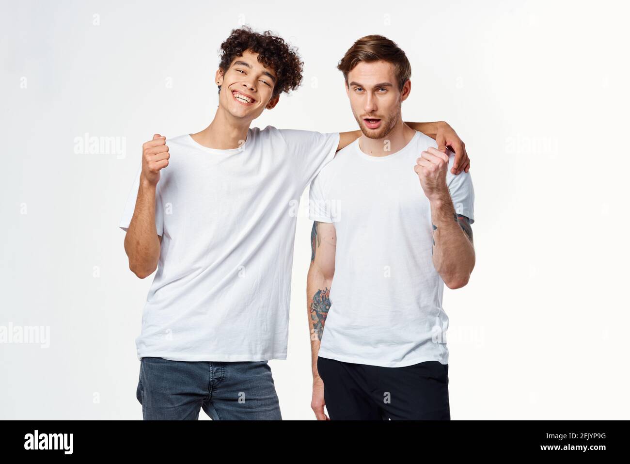 Two men back hug hi-res stock photography and images - Alamy