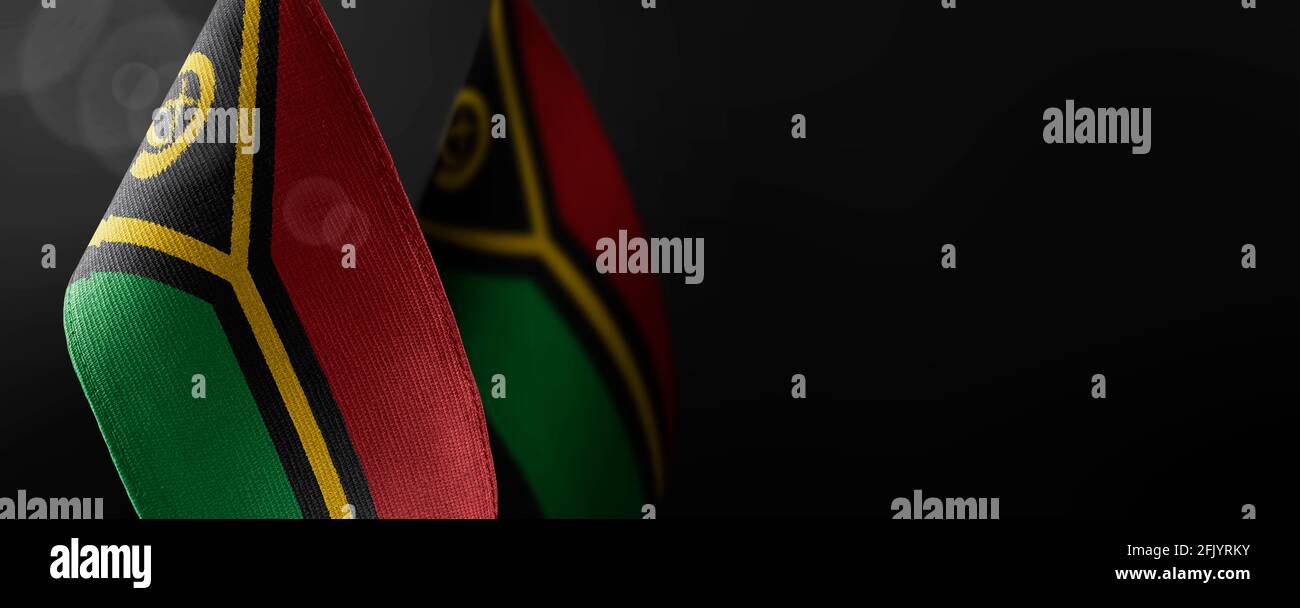 Small national flags of the Vanuatu on a dark background Stock Photo ...