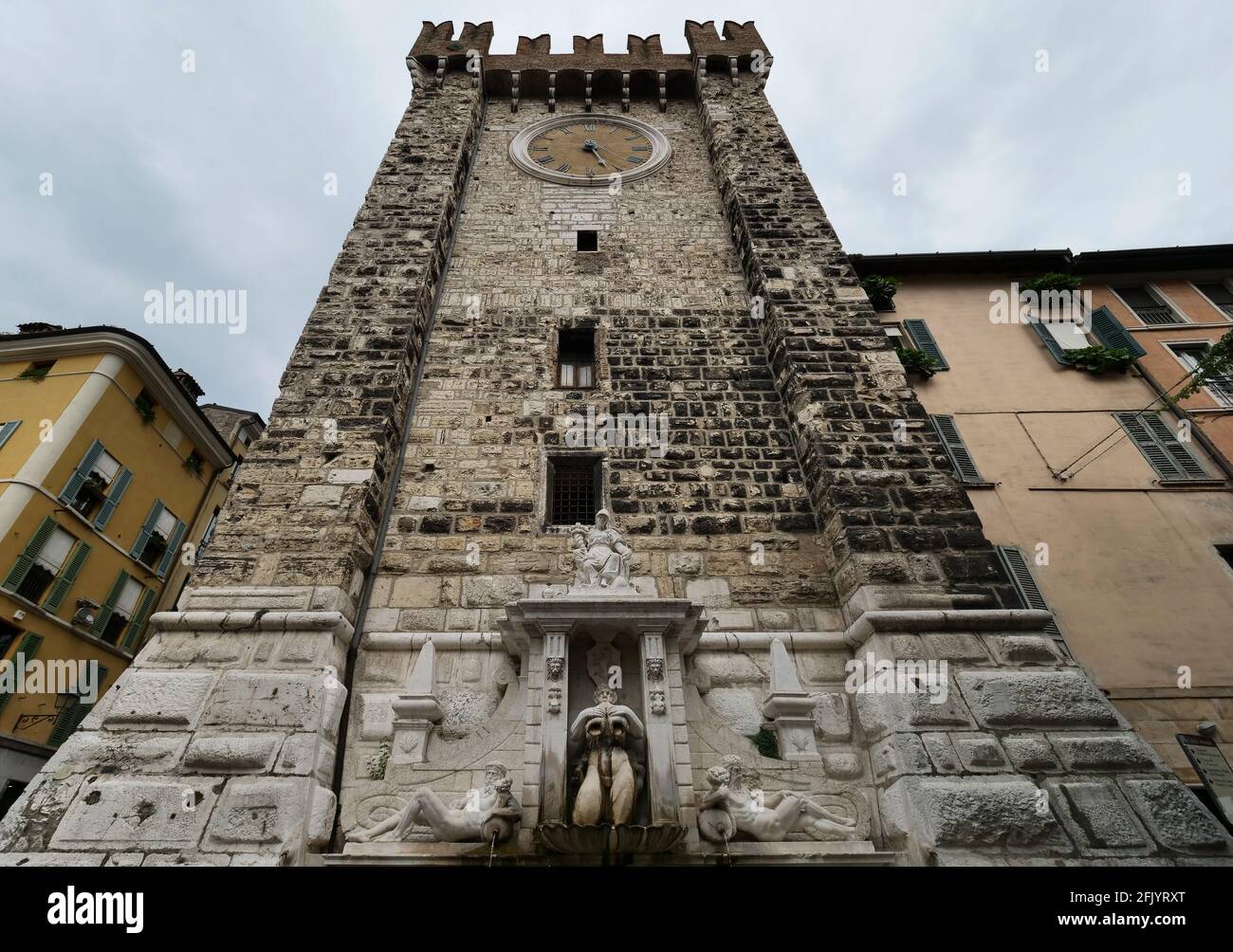 Torre della Pallata brick medieval clock tower building with merlons in ...