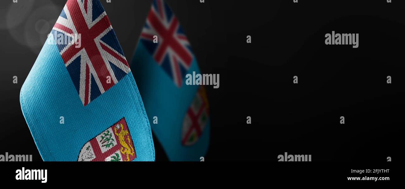 Small national flags of the Fiji on a dark background Stock Photo - Alamy
