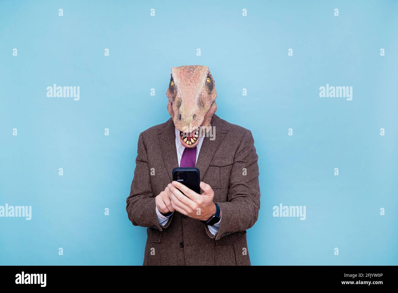 Lizard headed man using smartphone Stock Photo - Alamy