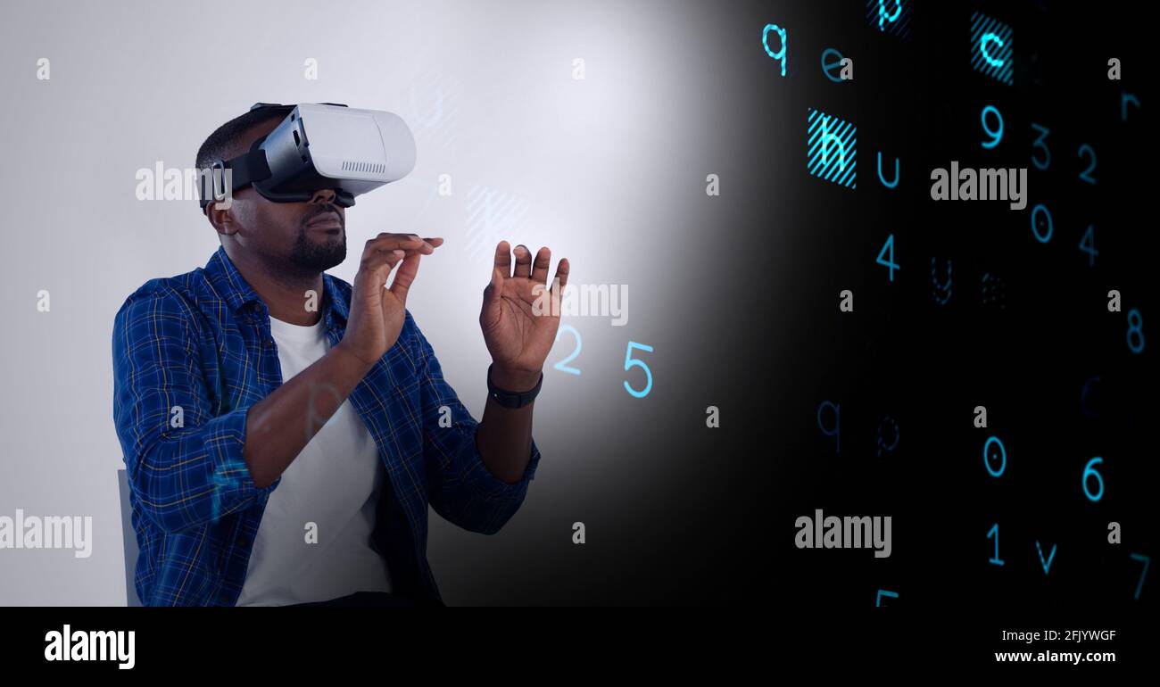 Composition of letters processing over man wearing vr headset and ...