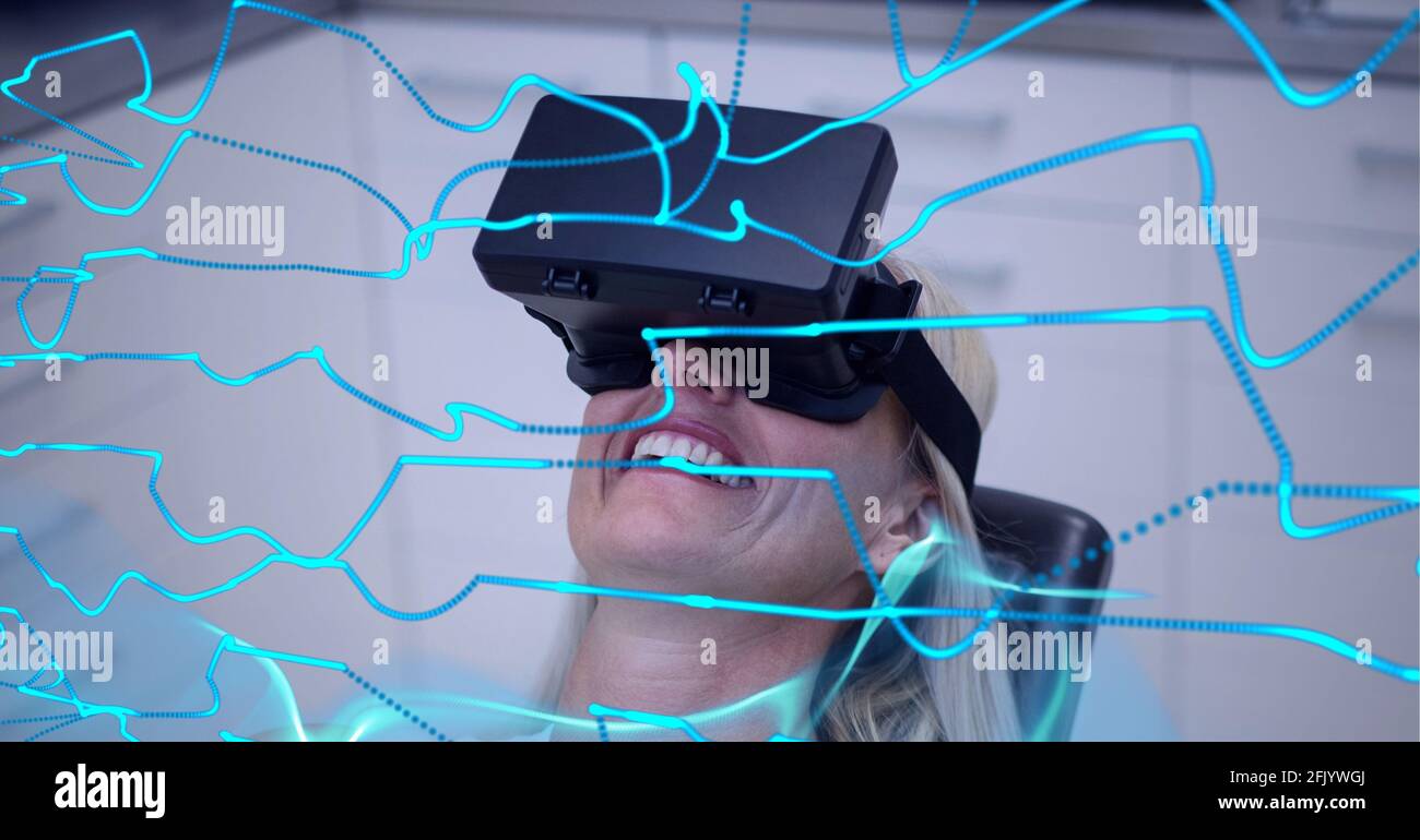 Animation blue trails over smiling hi-res stock photography and images ...