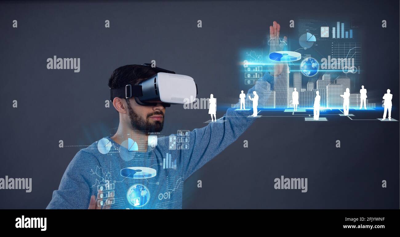 Composition of data processing and people icons over man wearing vr headset touching screen ...