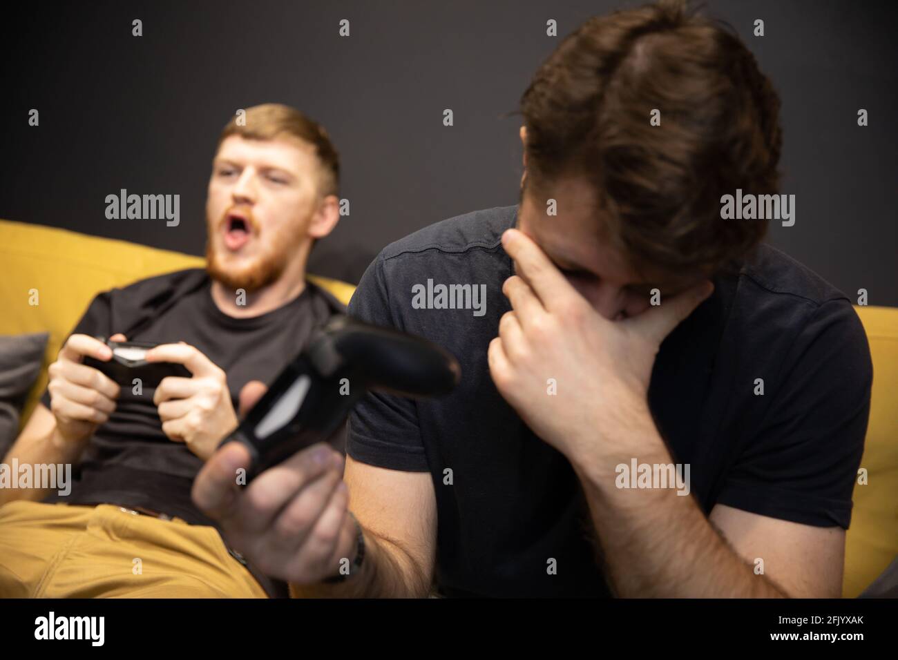 Win and lose concept. gamer covered his eyes with palm upset at losing ...