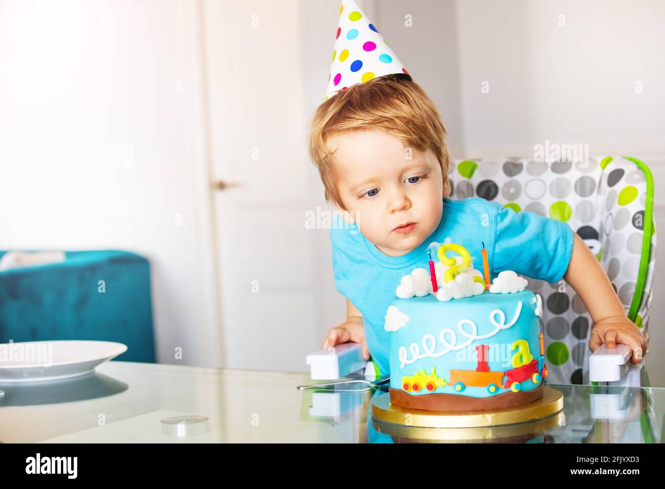 Toddler 2 years old, blow candles birthday cake Stock Photo - Alamy
