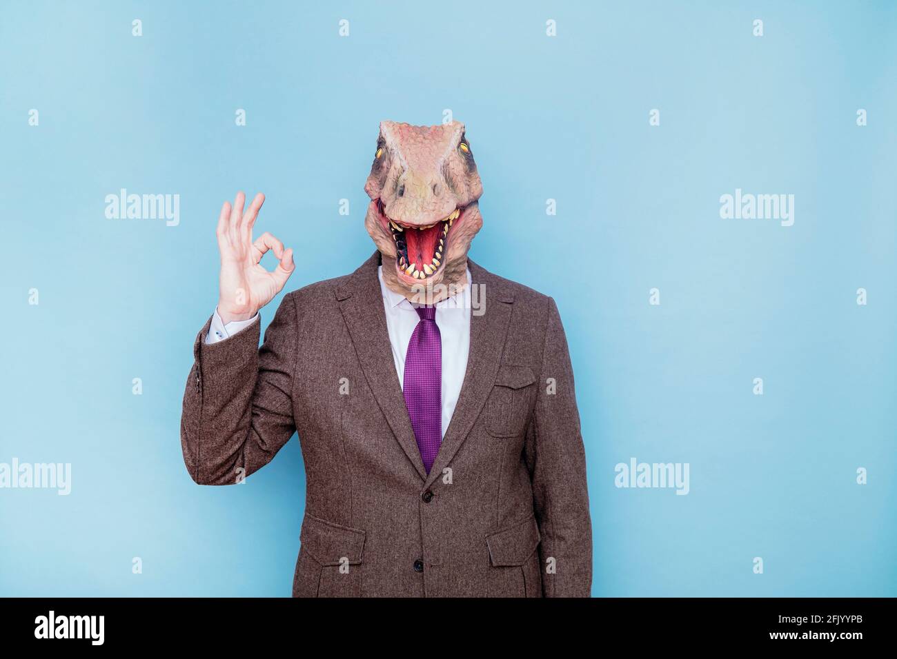 Man with euphoric lizard head and fingers with ok symbol Stock Photo ...