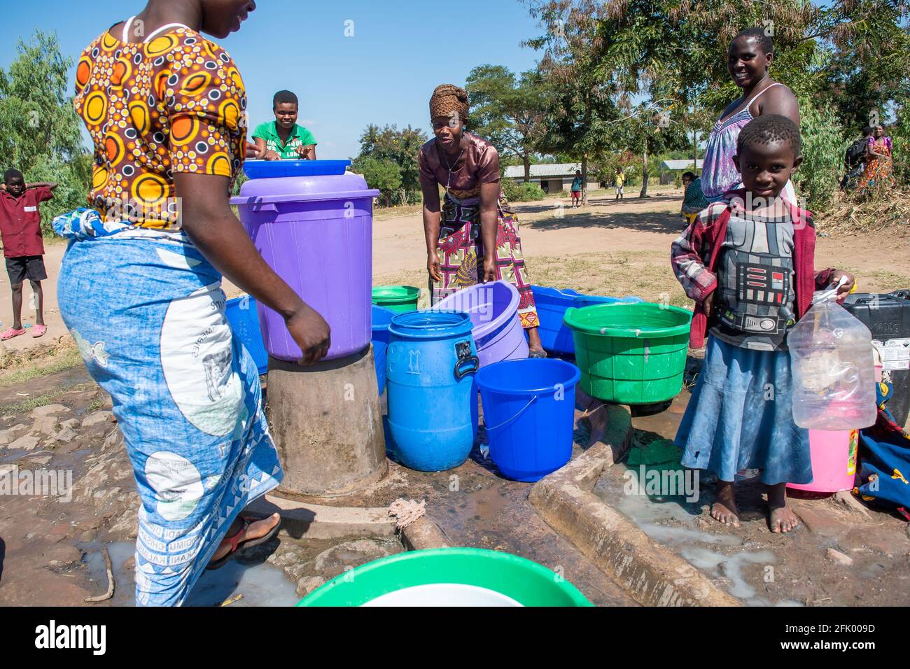 African children fetch water hi-res stock photography and images - Alamy