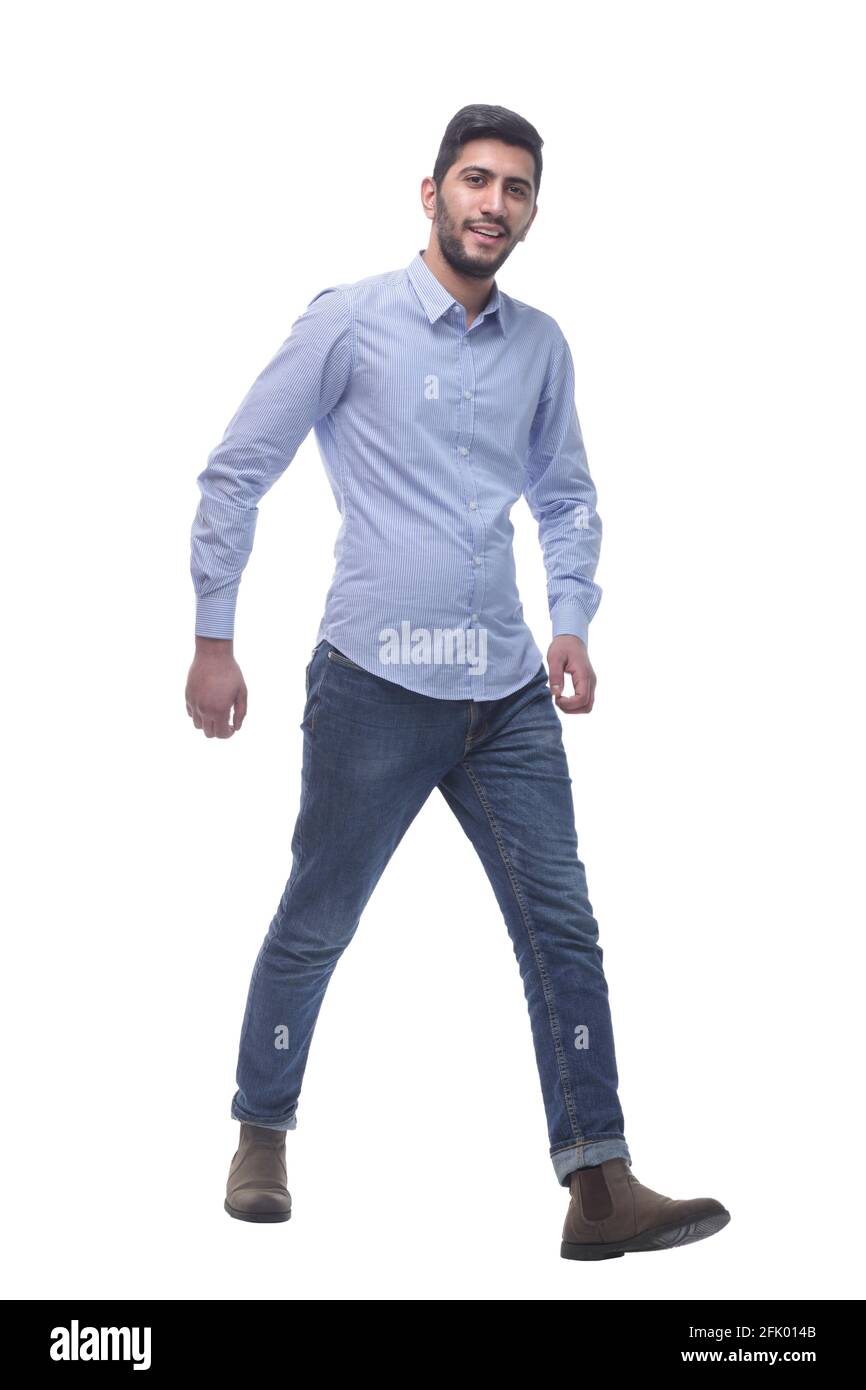 confident young man in jeans striding forward Stock Photo - Alamy