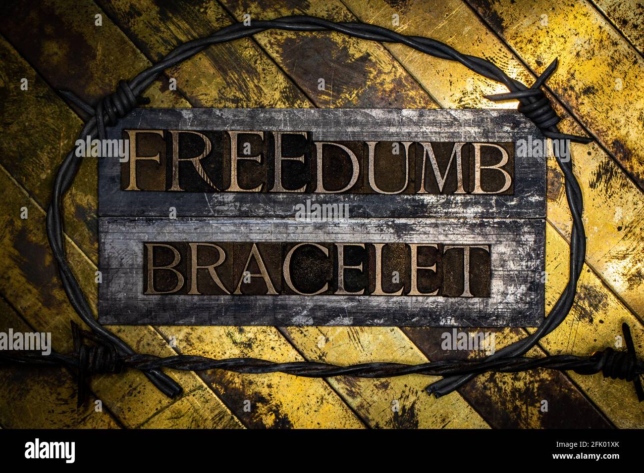 Freedumb Bracelet from barbed wire with text on vintage textured grunge ...