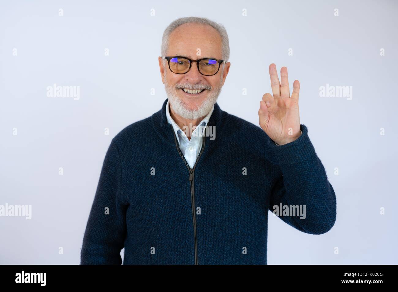 happy positive handsome old man shows okay sign over white background ...