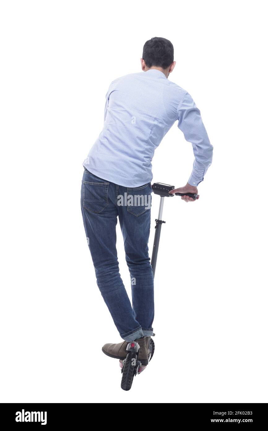 rear view. young man leaving on an electric scooter Stock Photo - Alamy