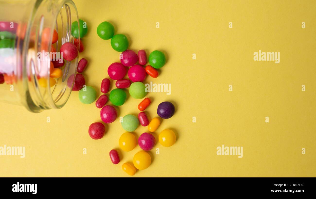 colorful little candies on a colored background Stock Photo - Alamy