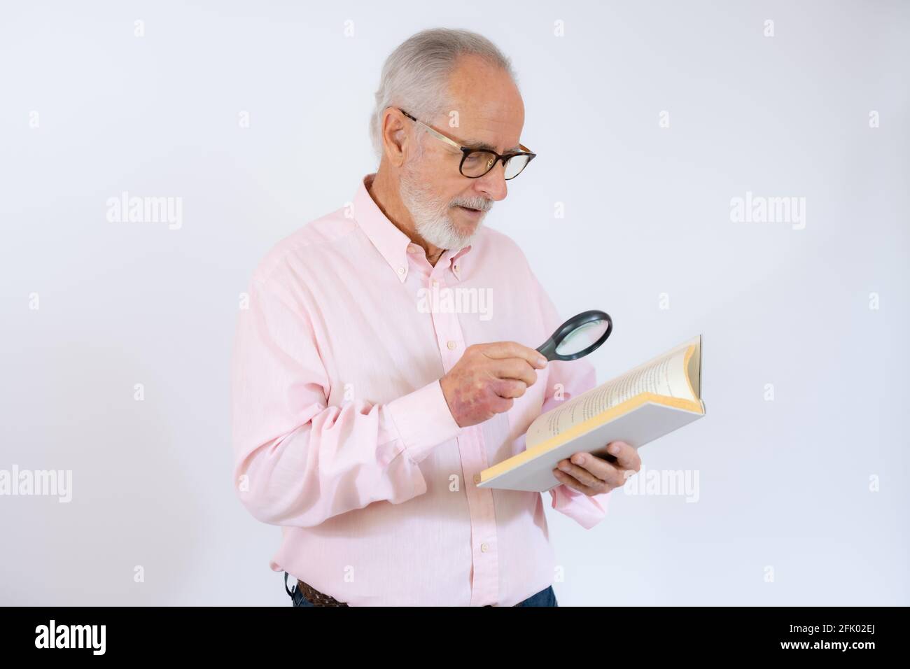 Studio shot of a senior man reading a book on white background Stock ...