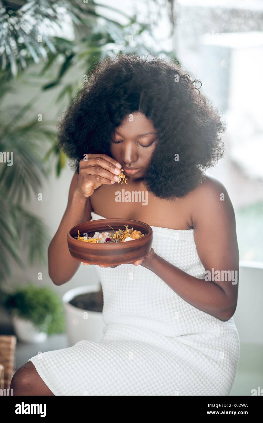 Pretty african american woman spending time in a spa salon Stock Photo ...