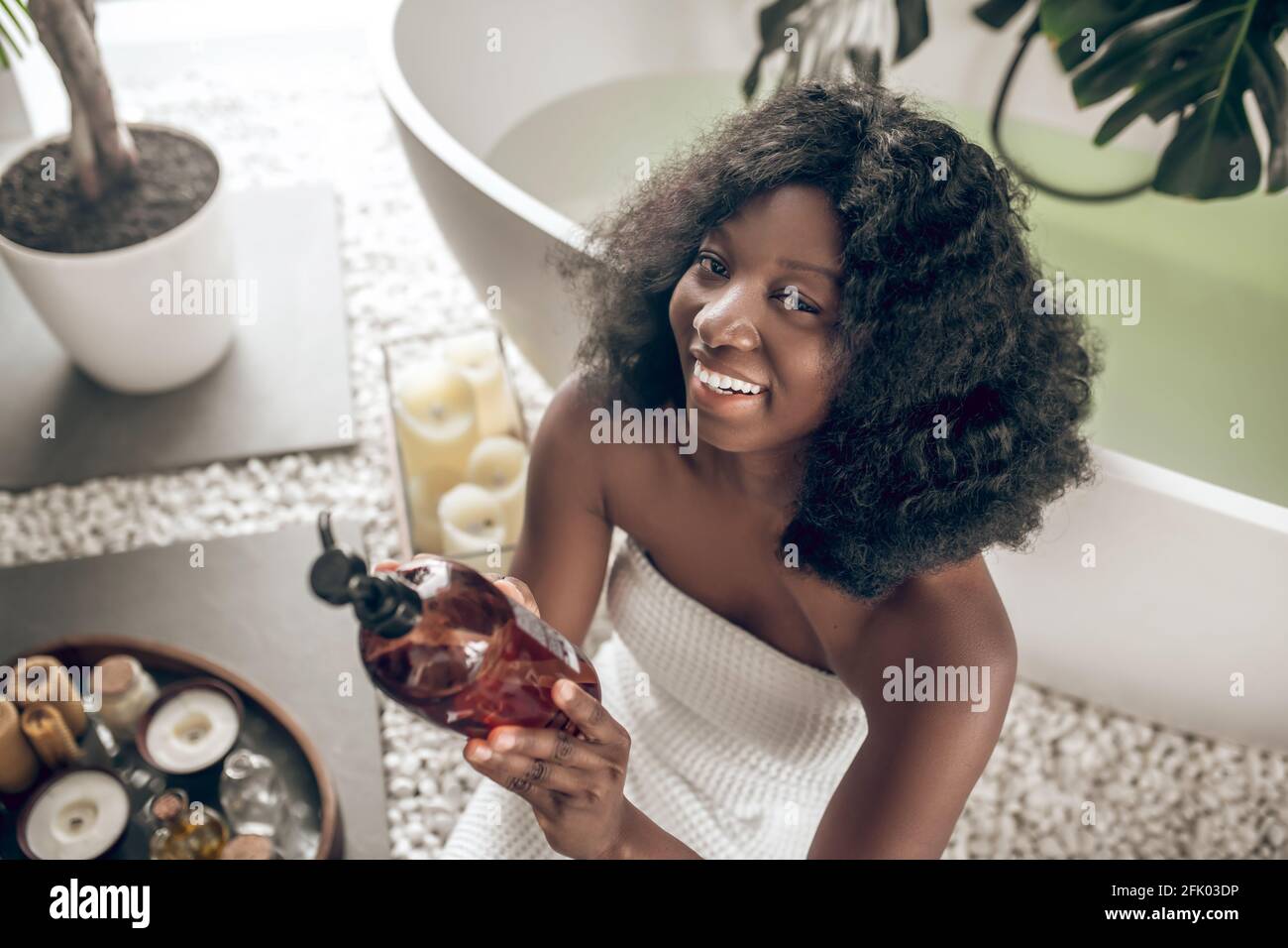 Pretty african american woman with natural beauty products Stock Photo - Alamy