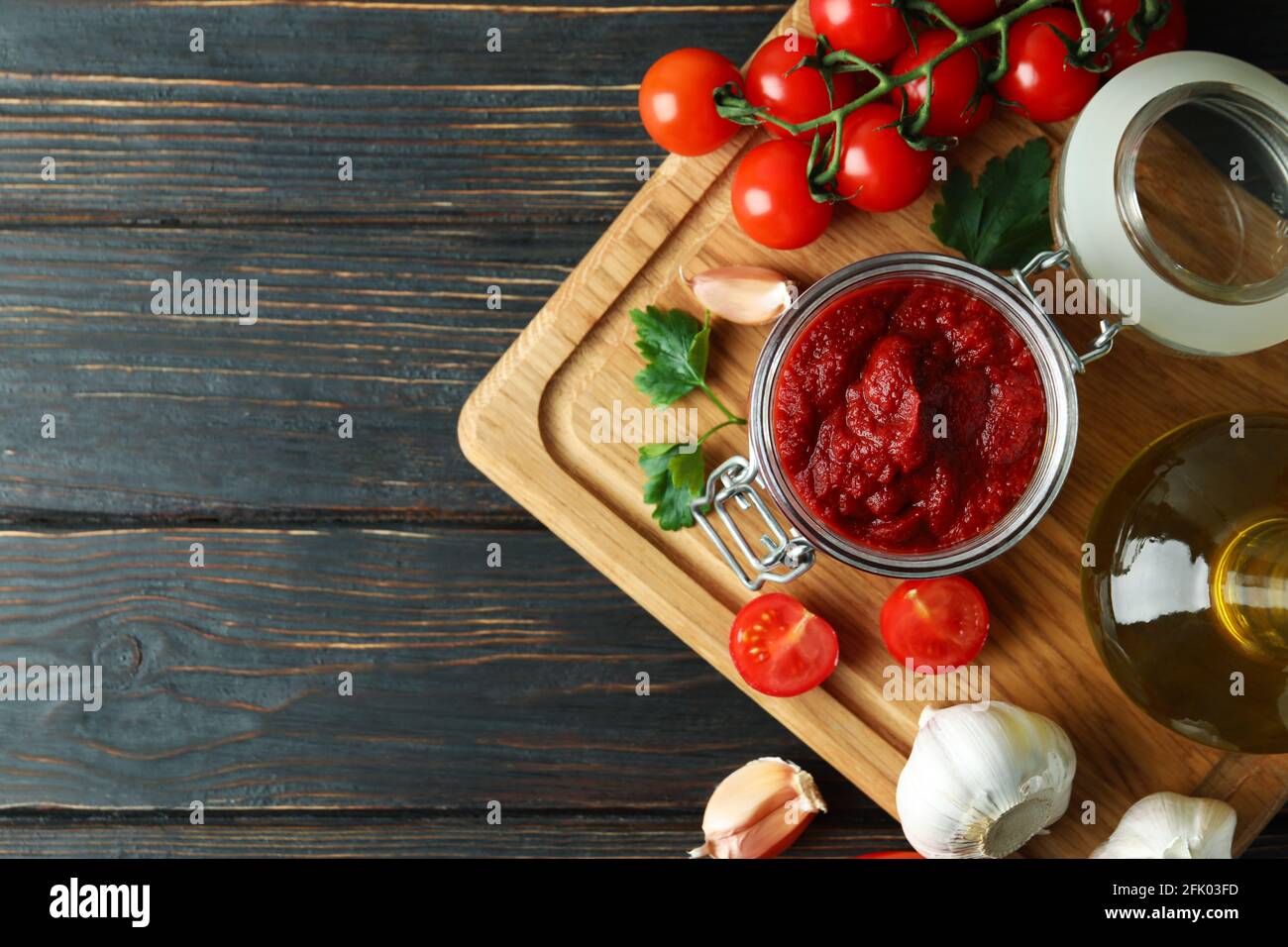 Jar with tomato paste on wooden table with ingredients Stock Photo - Alamy