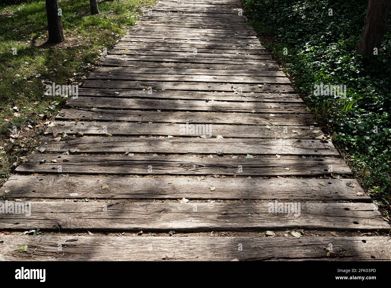 Weathered wooden footpath texture as background Stock Photo - Alamy