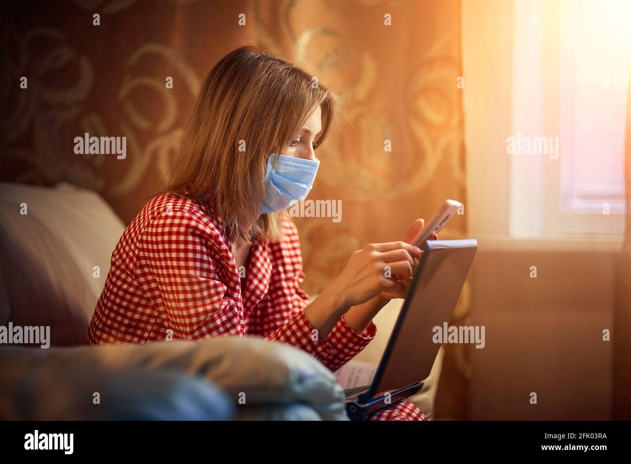 Young european woman wearing surgical face mask stay at home during ...