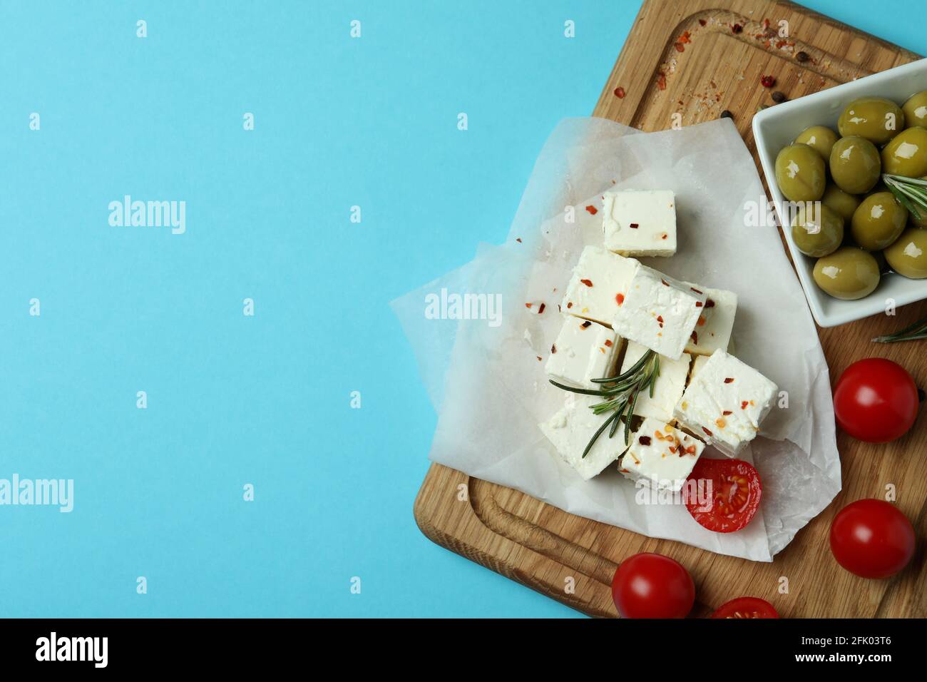 Concept of tasty food with feta cheese on blue background Stock Photo ...