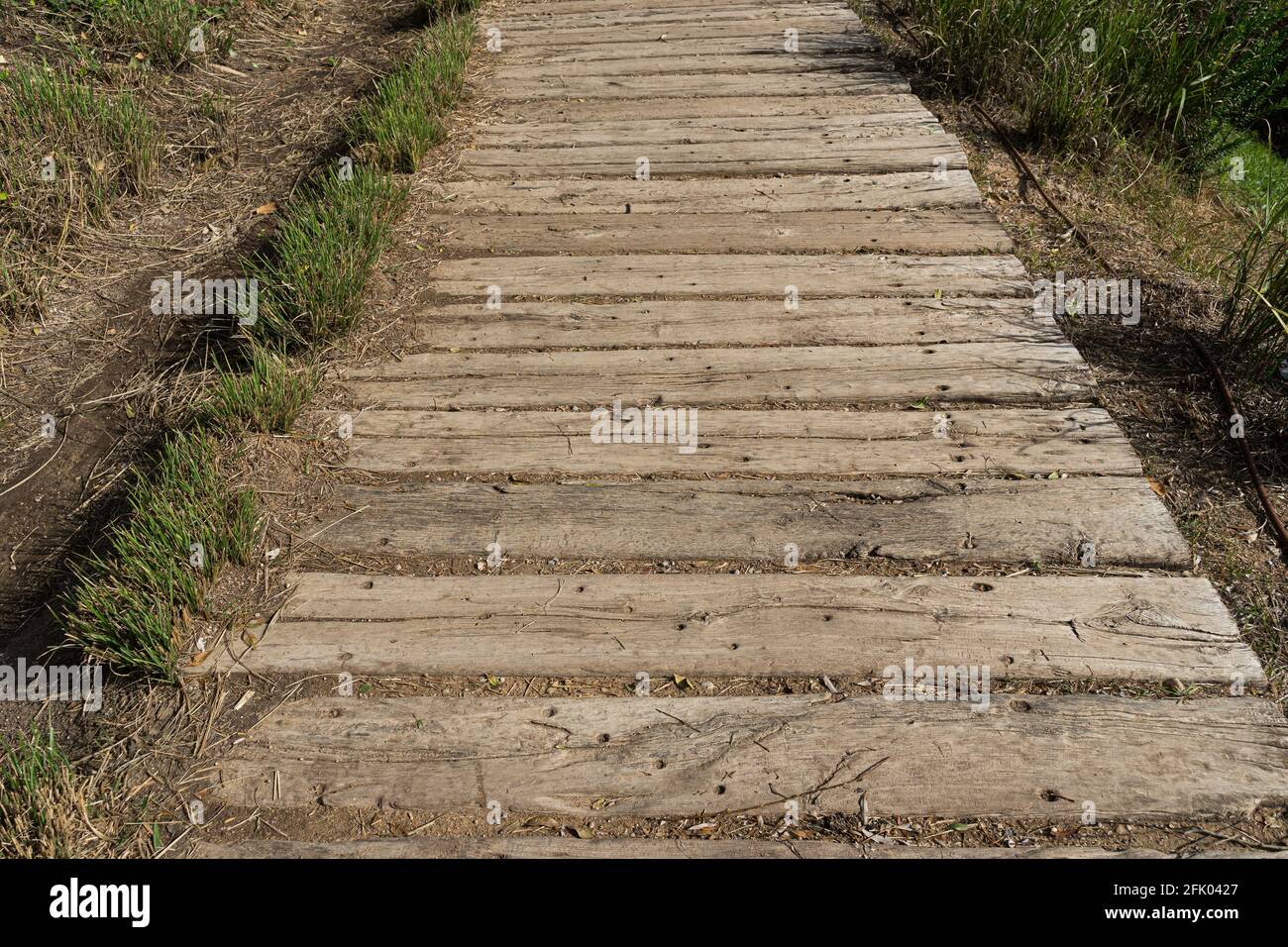 Weathered wooden footpath texture as background Stock Photo - Alamy