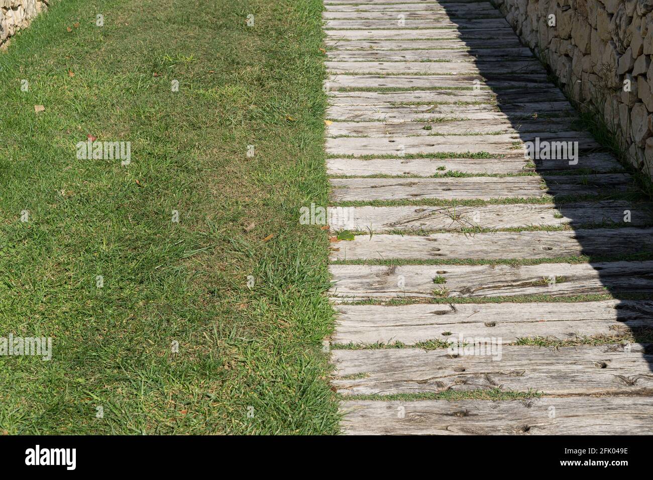 Weathered wooden footpath texture as background Stock Photo - Alamy