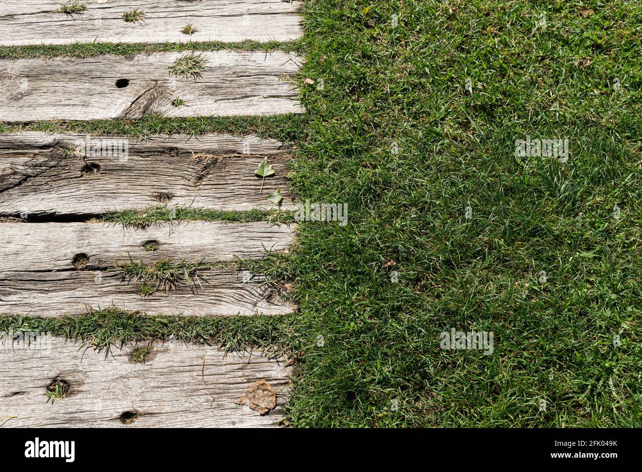 Weathered wooden footpath texture as background Stock Photo - Alamy