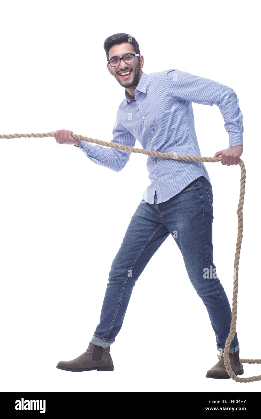 purposeful young man pulls the rope. isolated on a white background ...