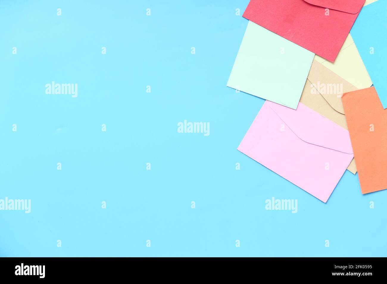 colorful envelope on blue background with copy space Stock Photo - Alamy