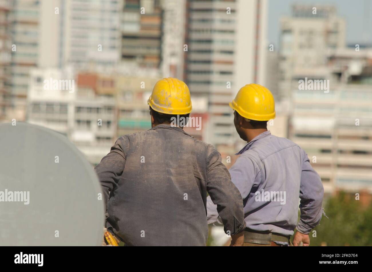 construction workers resting on working hours. with work clothes and ...