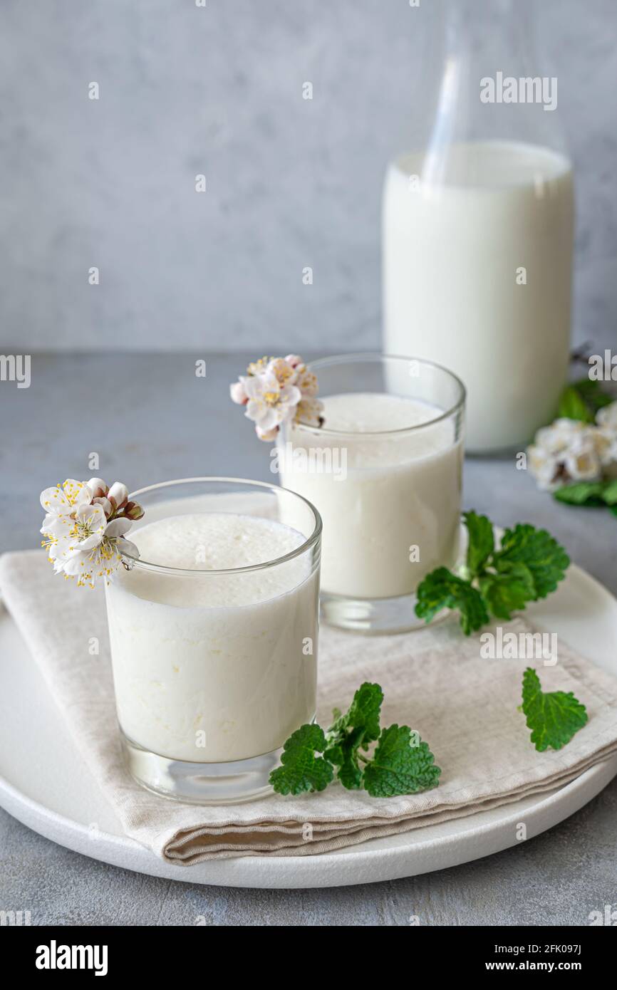 Traditional Indian drink lassi on a gray background. Refreshing, gentle ...