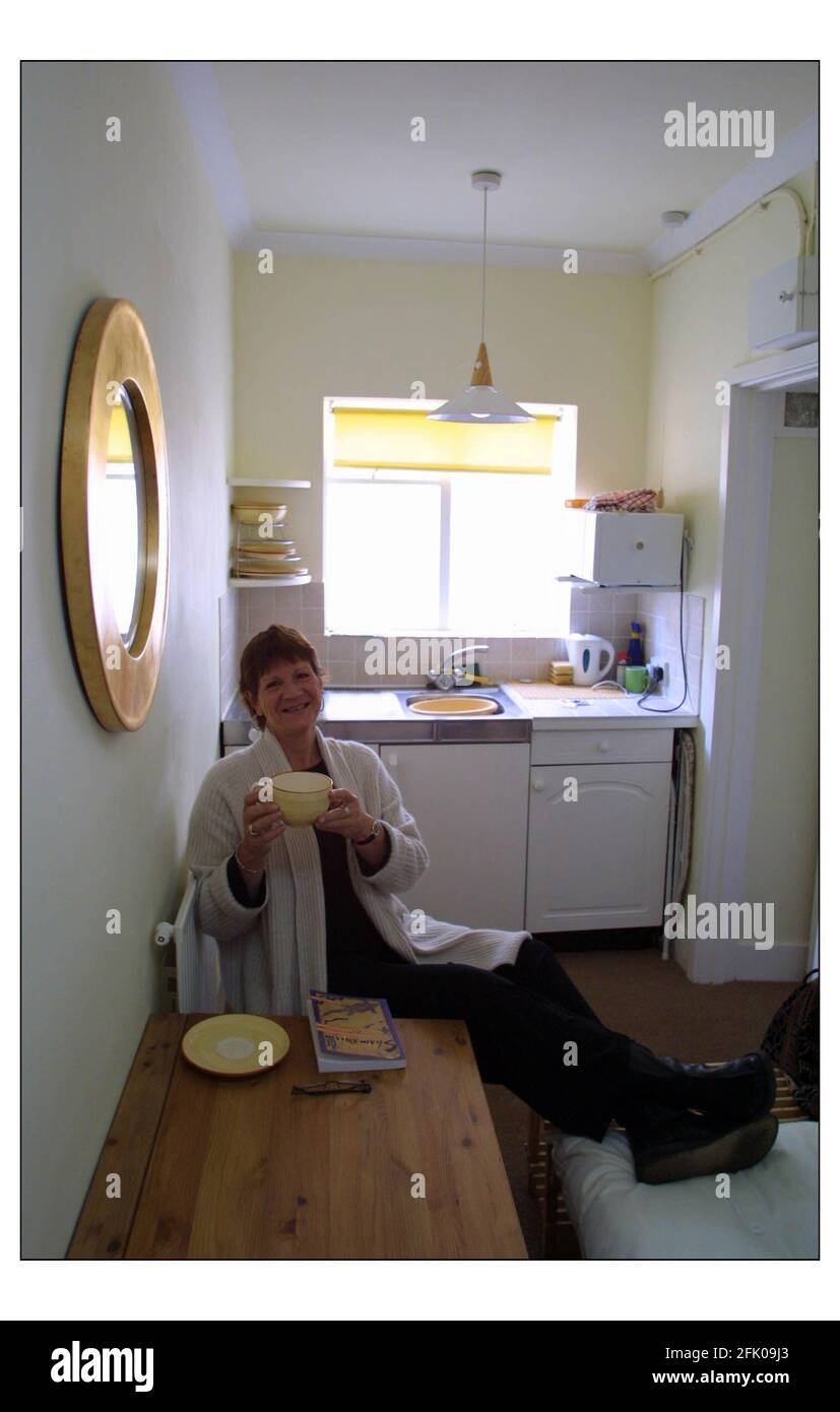 Sue Minns in her TINY flat...Her bed is in all pics showing the size of ...
