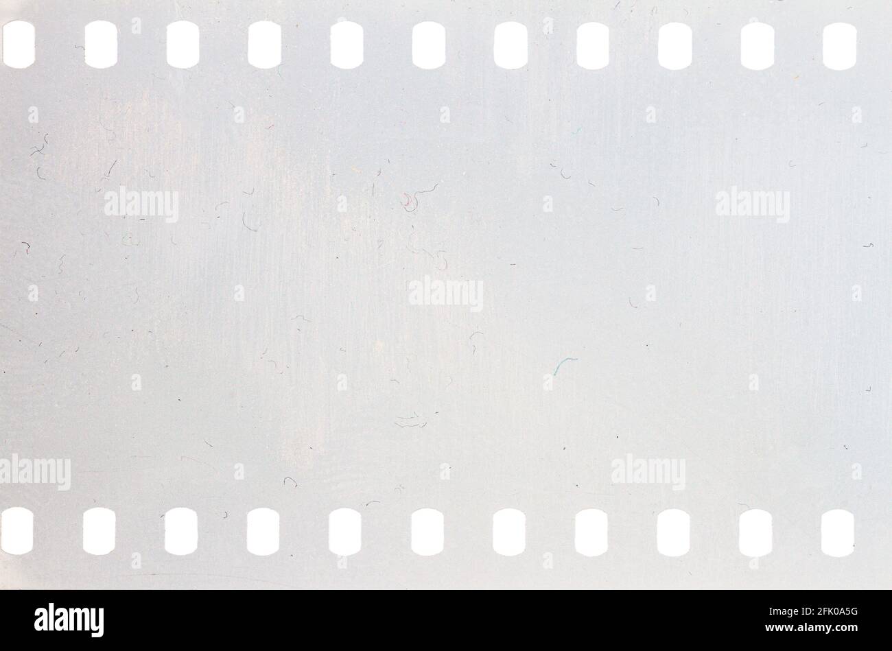 Dusty and grungy 35mm film texture or surface. Perforated camera film ...
