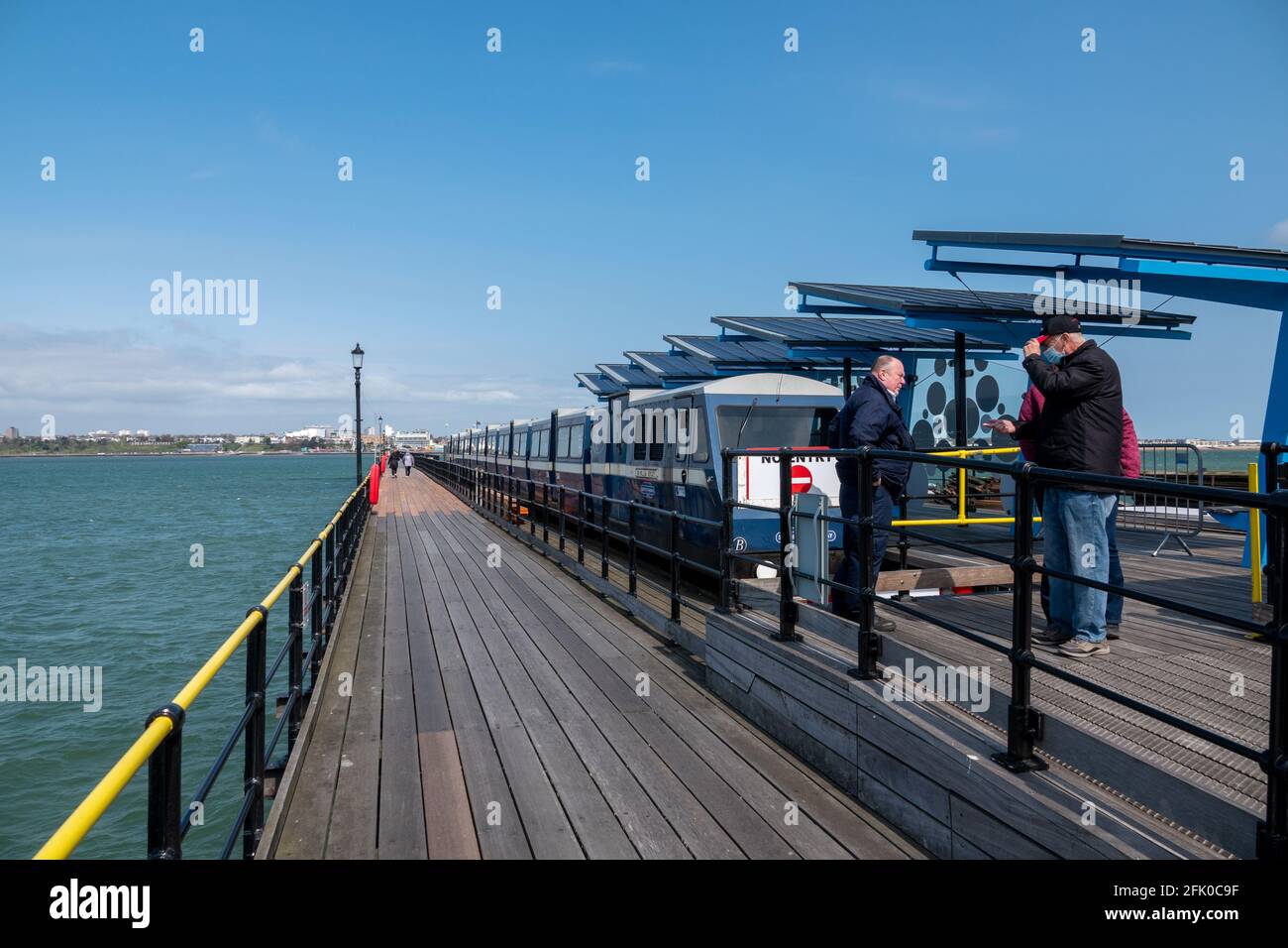 Southend on sea Pier, essex, uk in spring, people wrapped up against ...