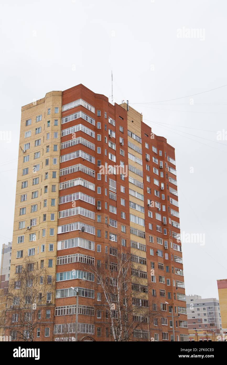 Residential high-rise building made of red and yellow bricks with ...