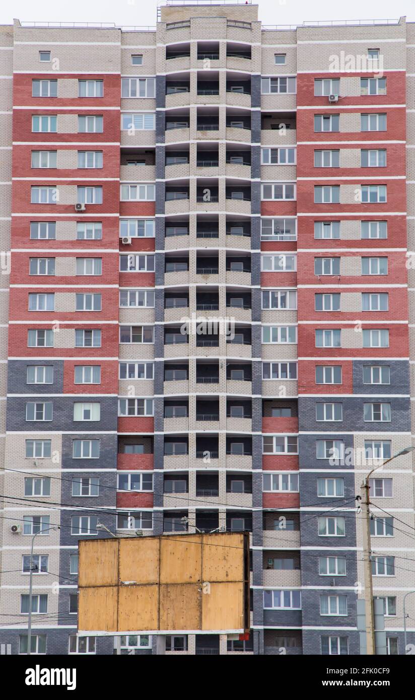 Residential high-rise multi-colored building made of red, gray and ...