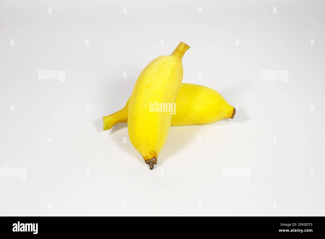 Two of banana yellow fruit isolated on white background Stock Photo - Alamy