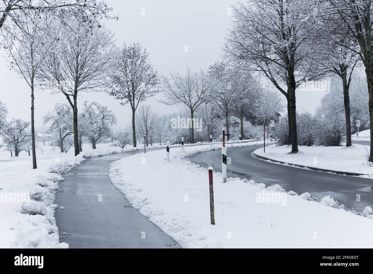 Kemptener street with snow during the winter, in Hergensweiler, Germany ...