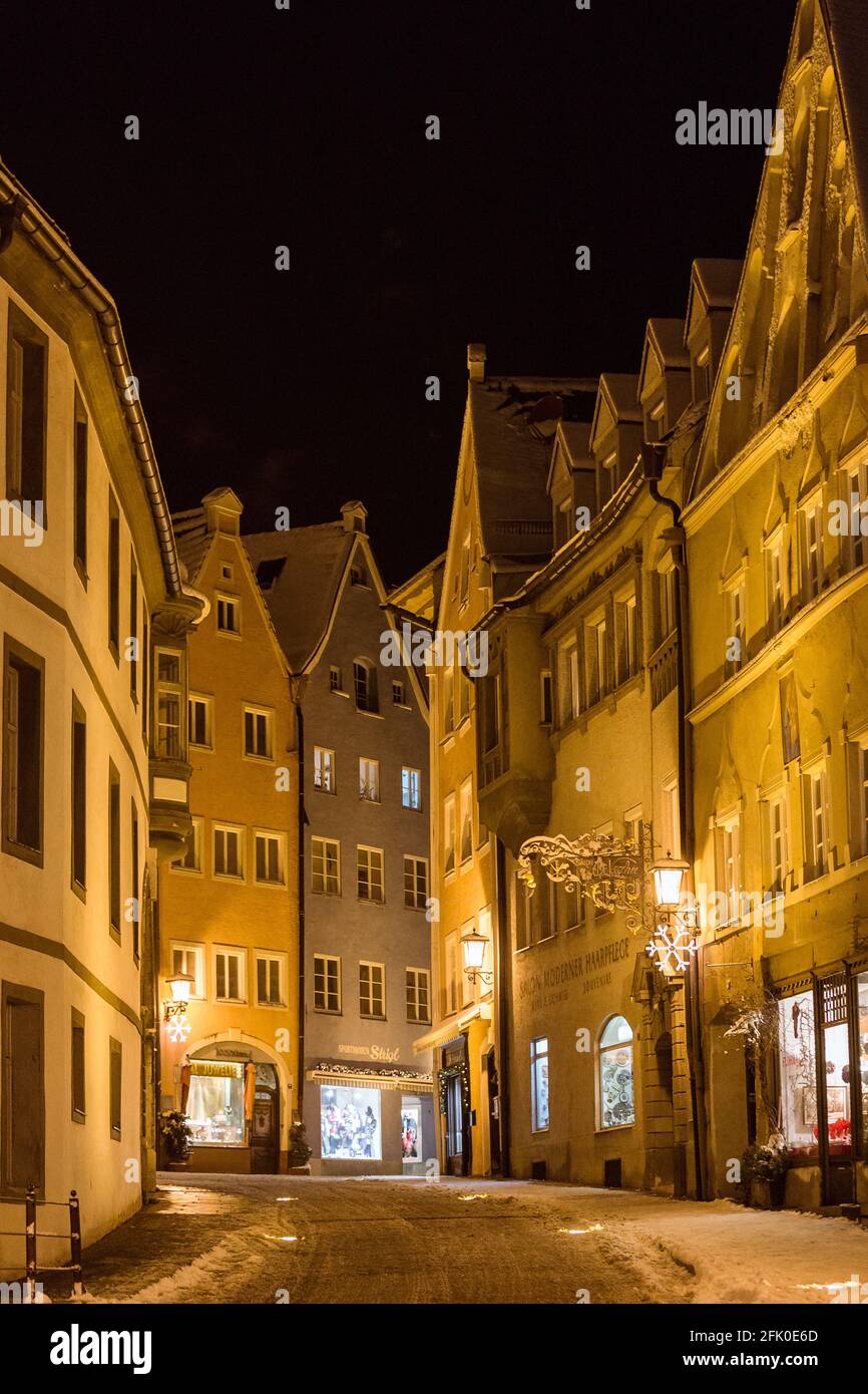 Snowy street in Füssen, on the south of Germany, illuminated by ...