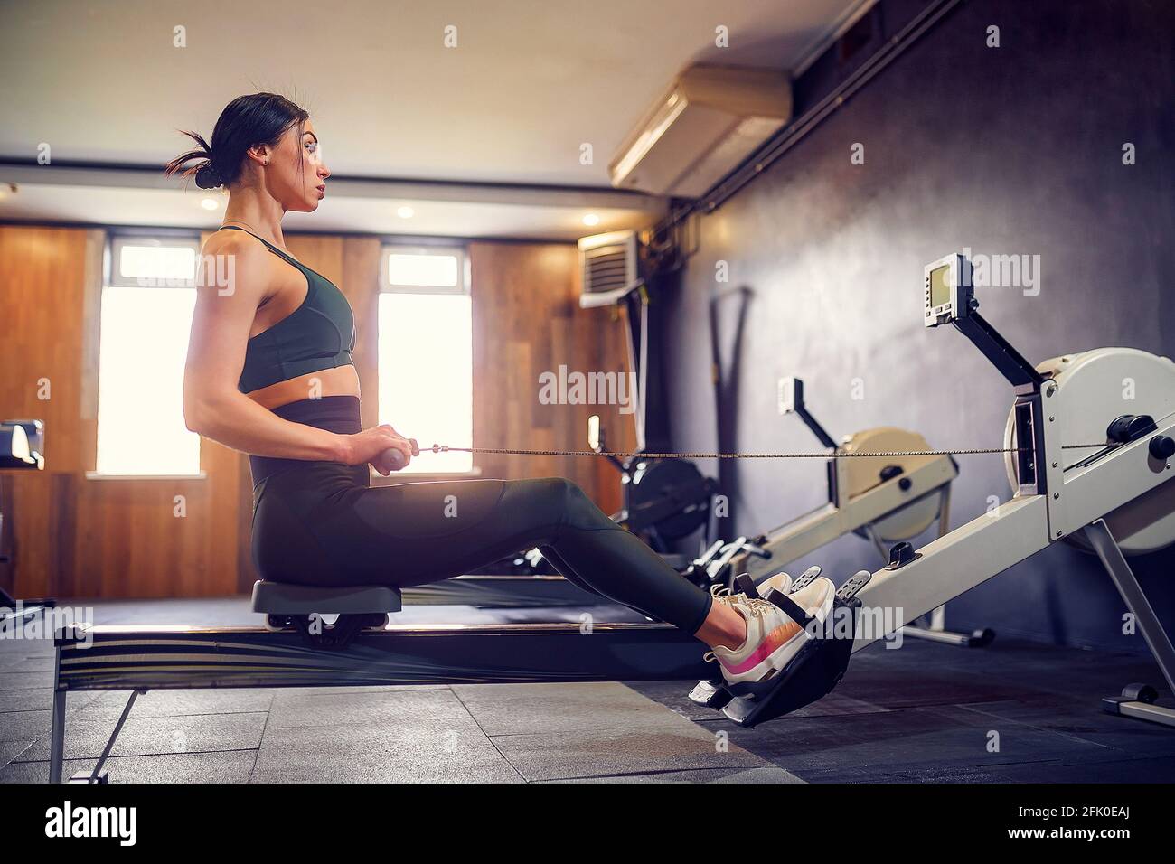 Woman sitting row machine hi-res stock photography and images - Alamy