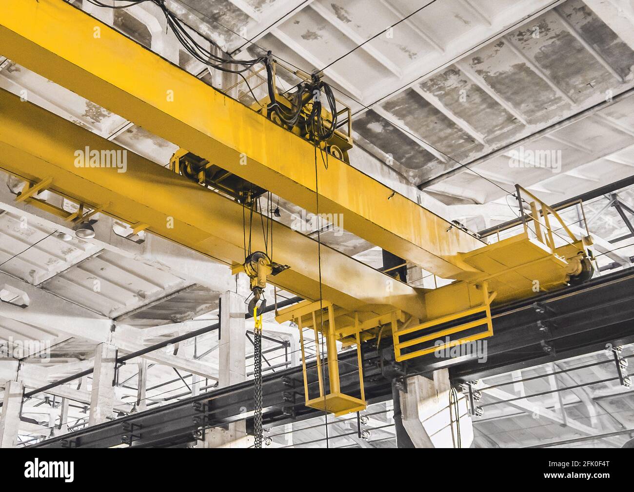 Part of an overhead building equipment crane in the background of an ...
