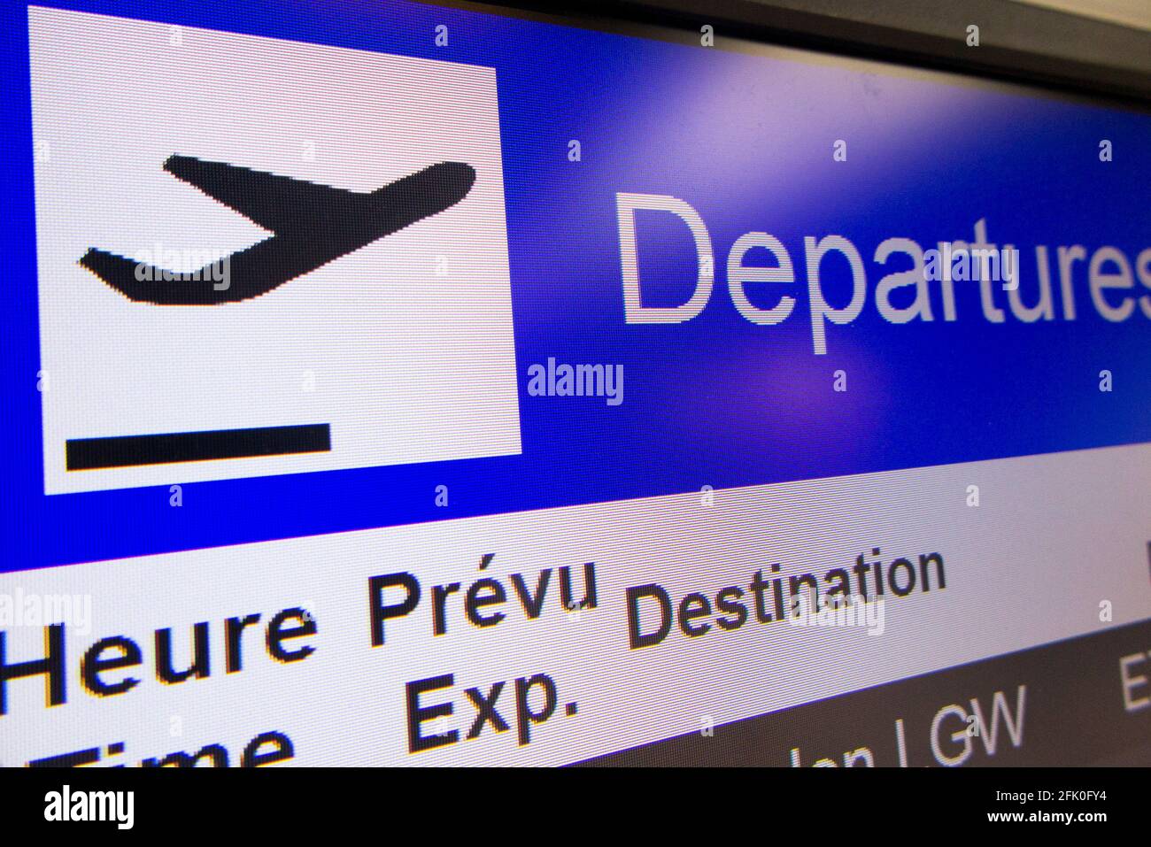 Sign board / screen indicating departure gates departing flights, in ...