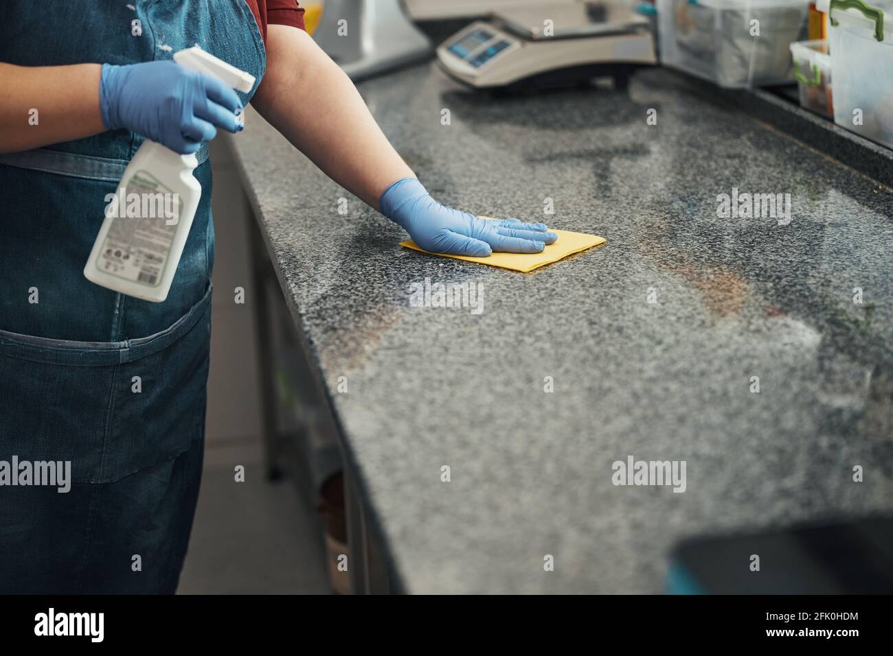 Responsible kitchen staff cleaning and desinfecting work surfaces Stock ...